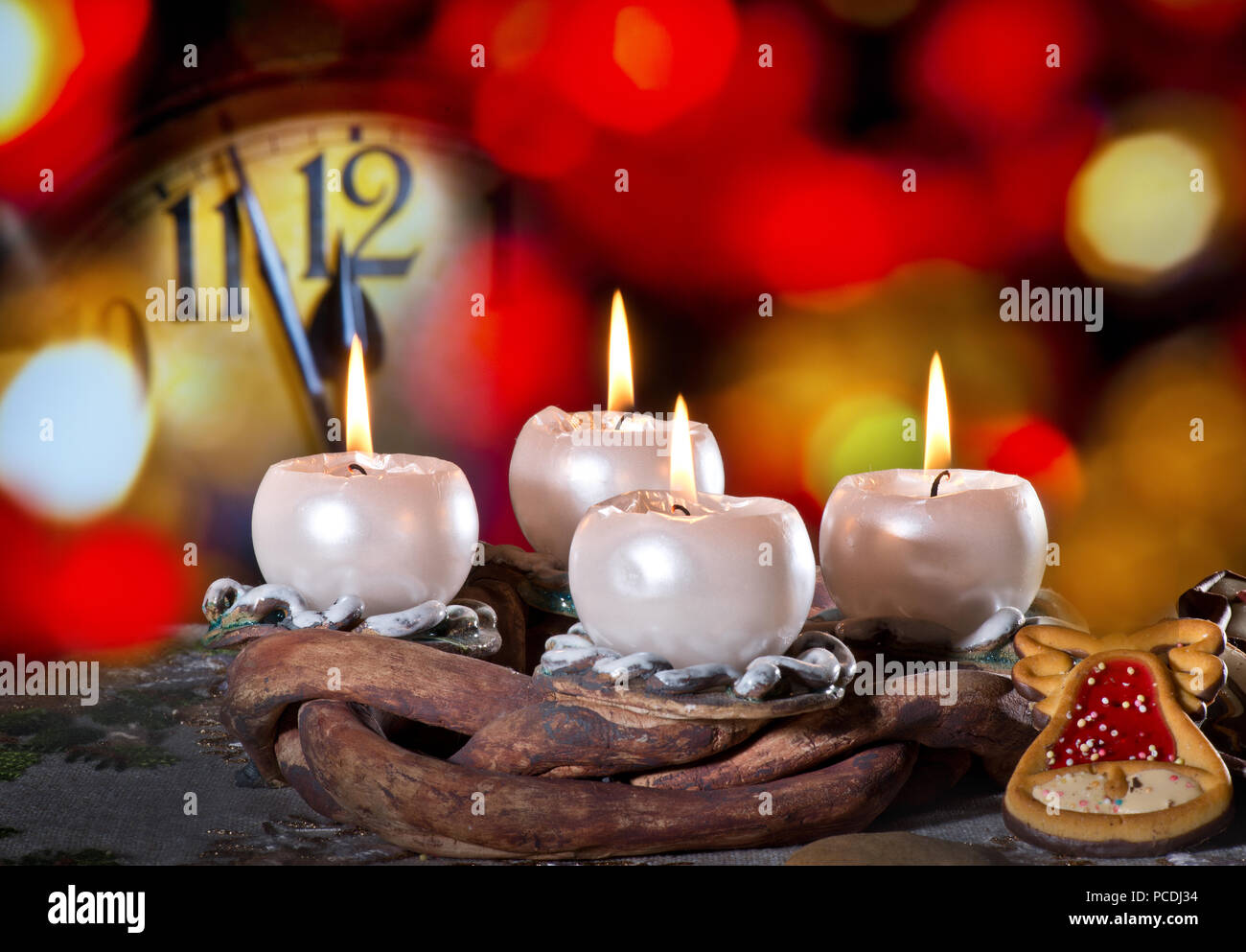 Advent Wreath with Burning Candles in front of New Year Clock Stock ...