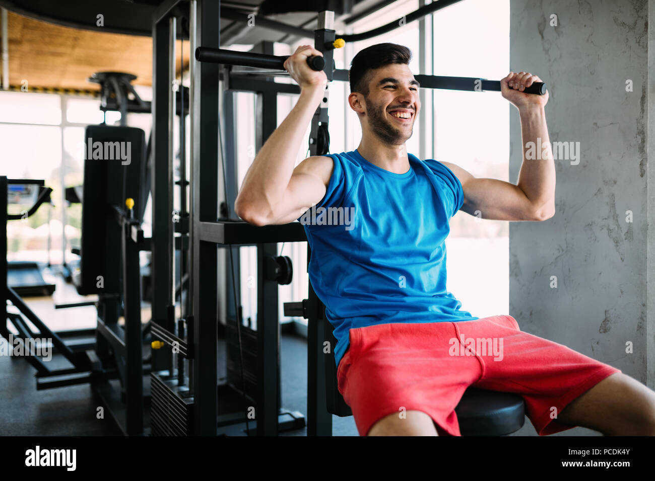 Man working out in gym Stock Photo - Alamy