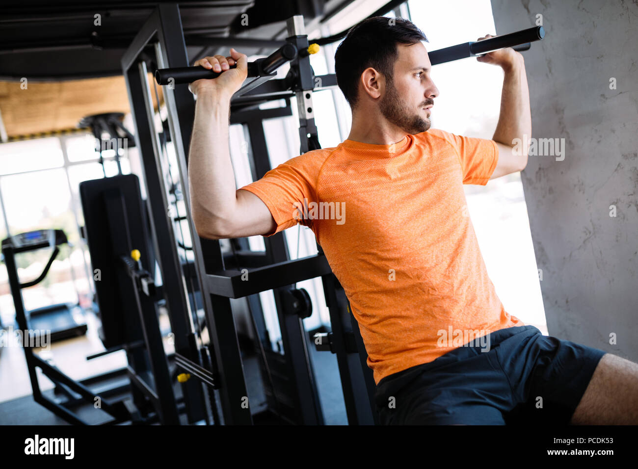 Man working out in gym Stock Photo - Alamy