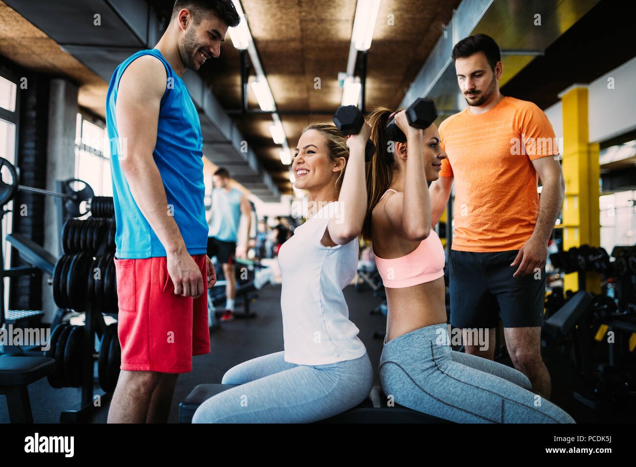 Working out in fitness center Stock Photo - Alamy