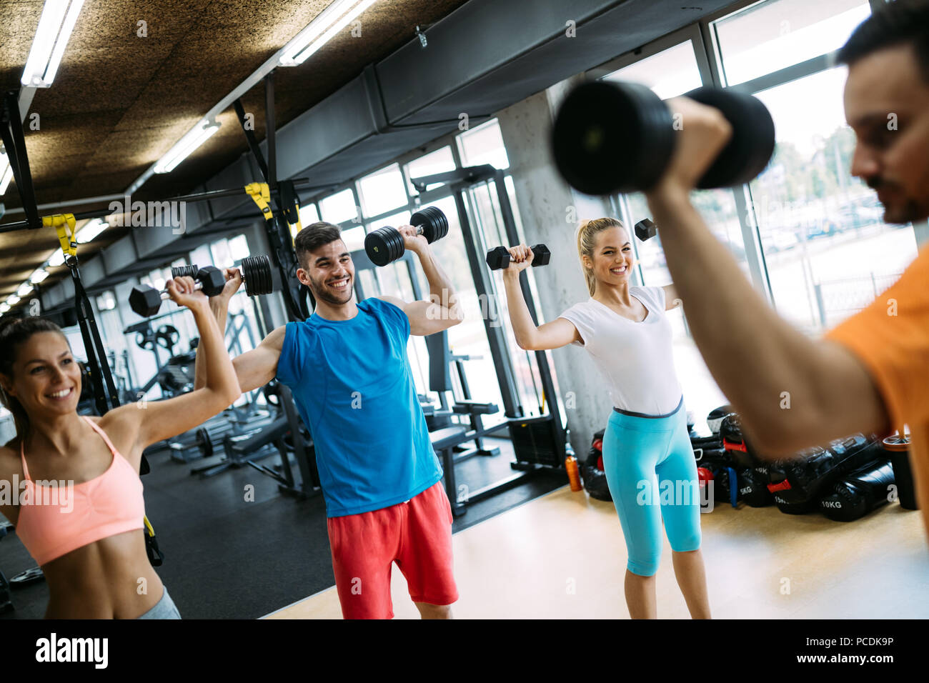 Group of people have workout in gym Stock Photo - Alamy
