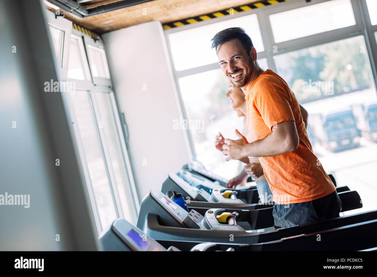 Picture of people running on treadmill in gym Stock Photo - Alamy