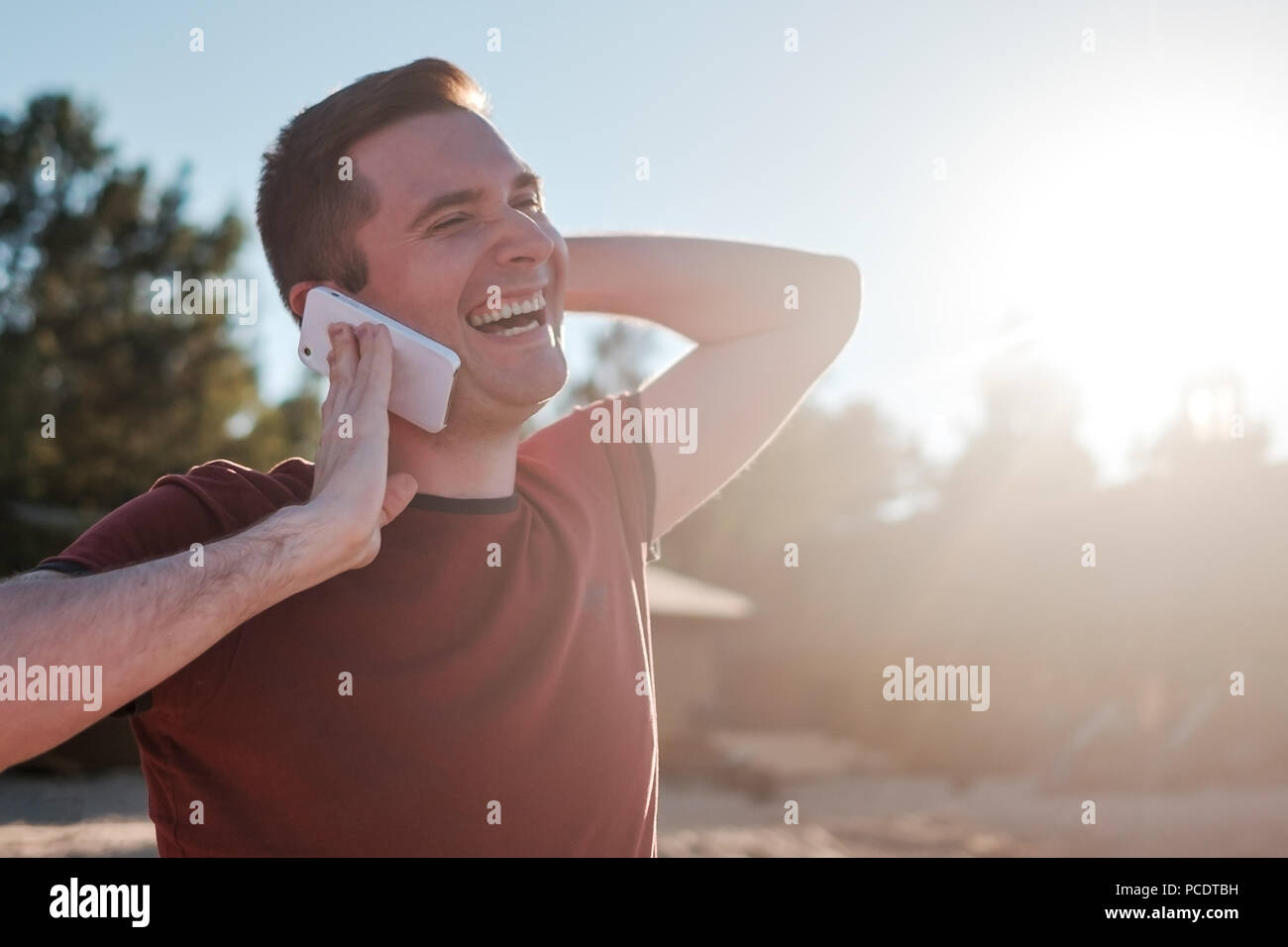 Happy smiling handsome man speaking hi-res stock photography and images ...