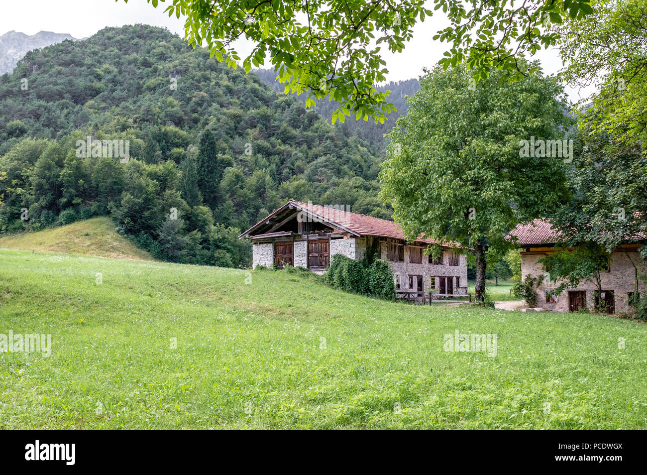 Traditional Italian alpine farm buildings Stock Photo - Alamy