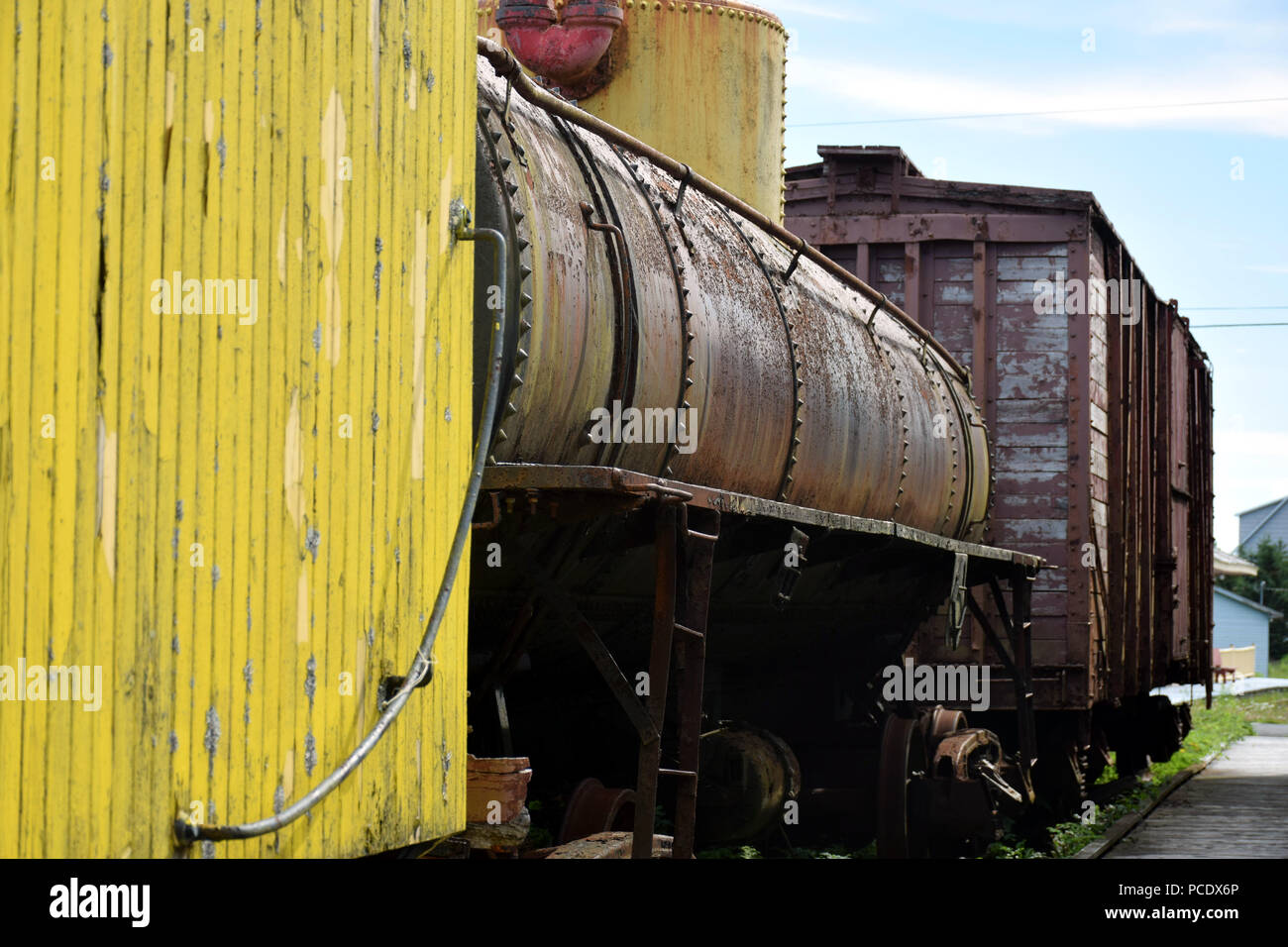 An old locomotive and a yellow wagon Stock Photo - Alamy