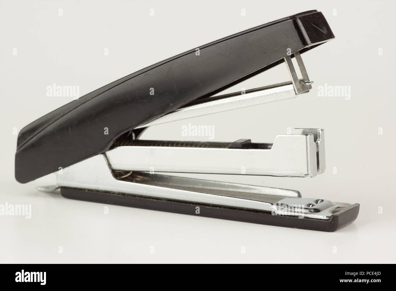 new stapler for stapling papers on a table Stock Photo - Alamy