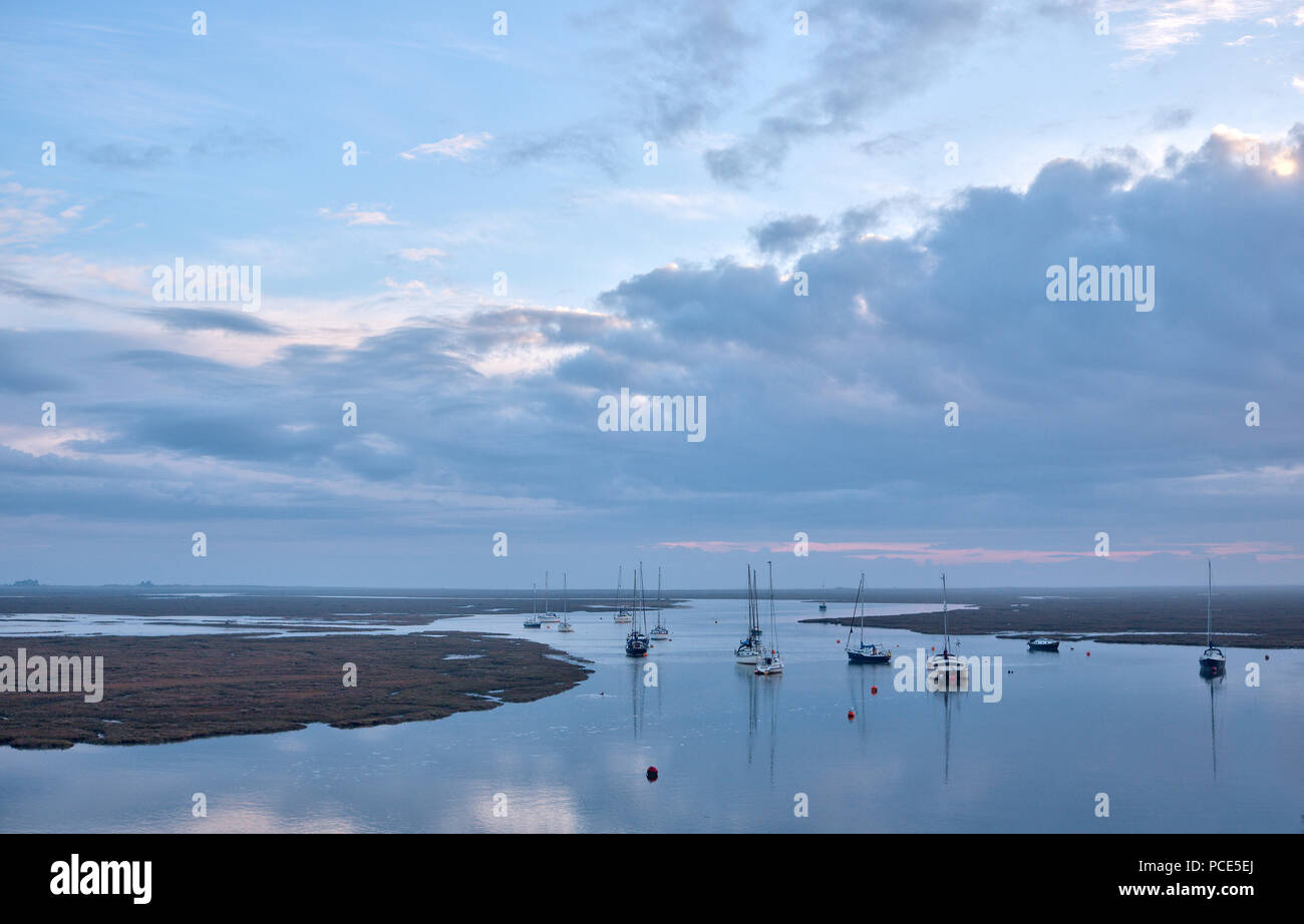 High tide at sunrise in the harbour at Wells next the Sea, North ...