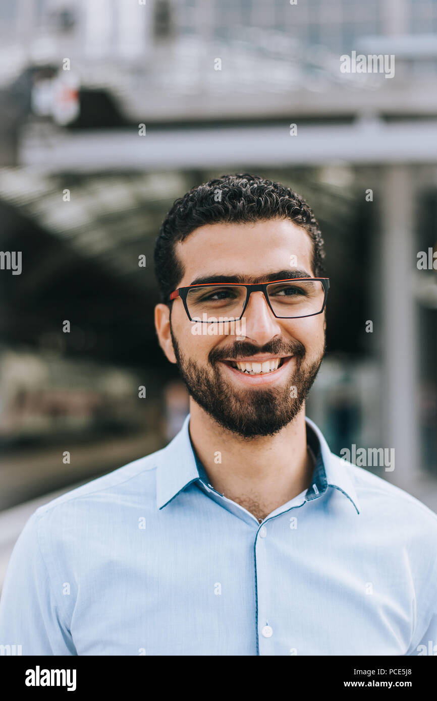 Portrait of handsome and cheerful syrian man at the train station Stock ...