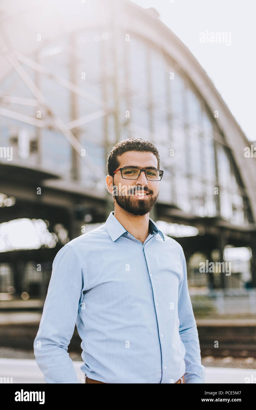 Portrait of handsome and cheerful syrian man at the train station Stock ...