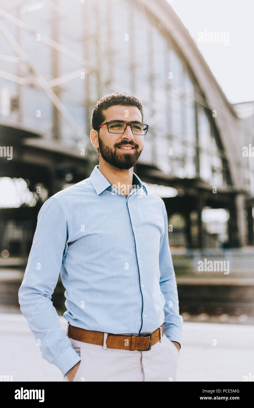 Portrait of handsome and cheerful syrian man at the train station Stock ...