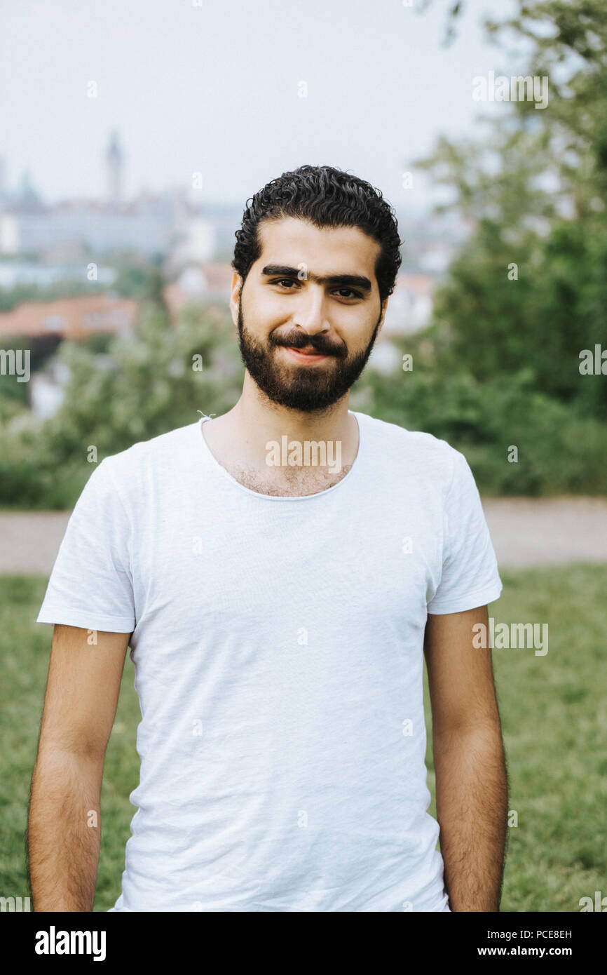 Outdoor portrait of cheerful Syrian man Stock Photo - Alamy