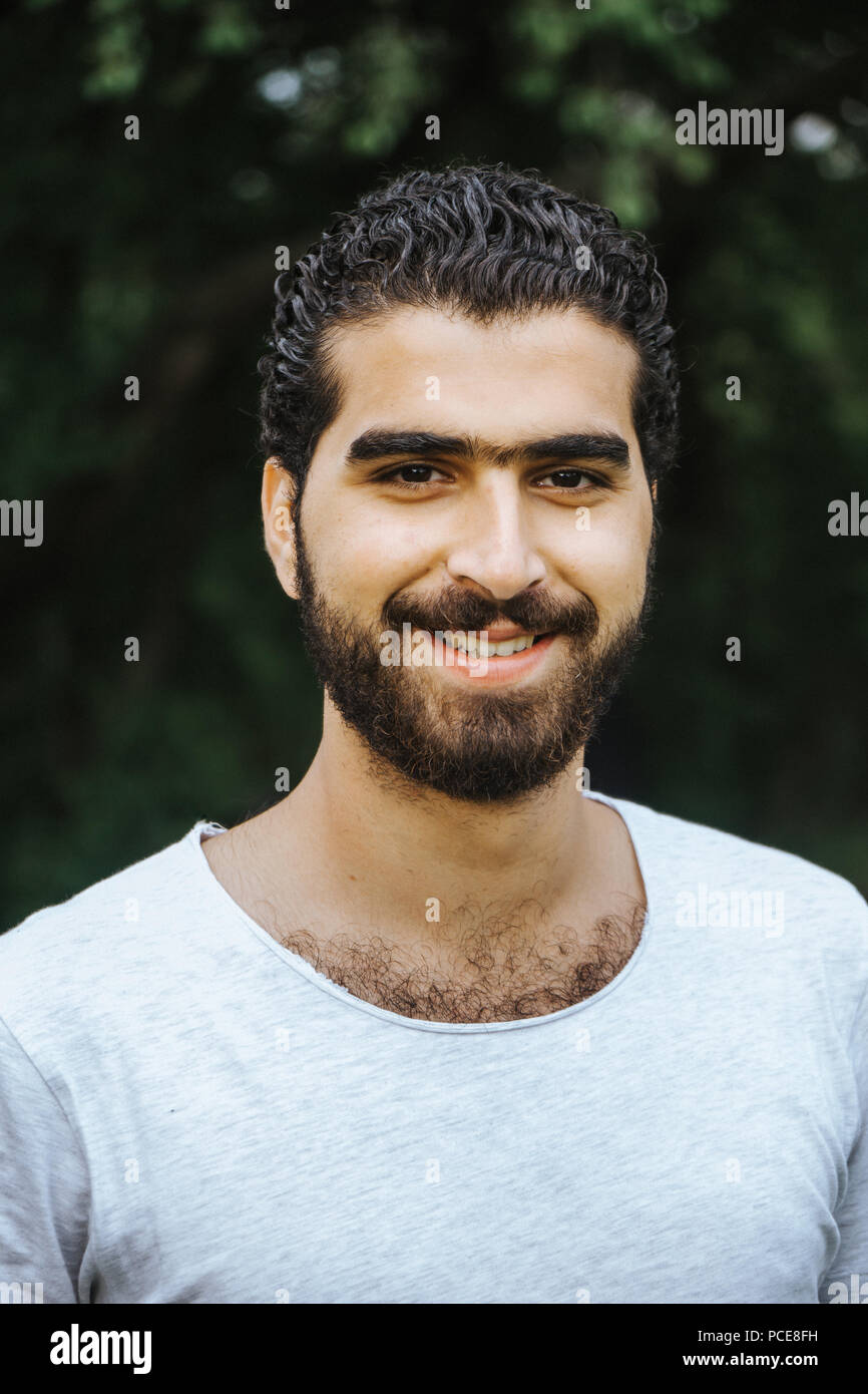 Outdoor portrait of cheerful Syrian man Stock Photo - Alamy