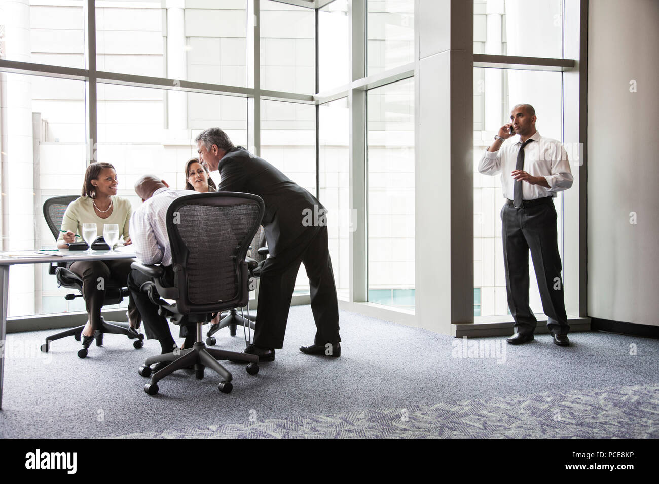 Businessman thinking during a meeting hi-res stock photography and ...