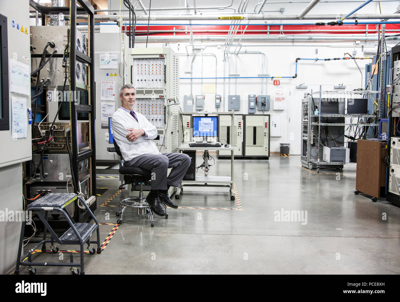 A portrait of a caucasian male technician in a technical research and ...