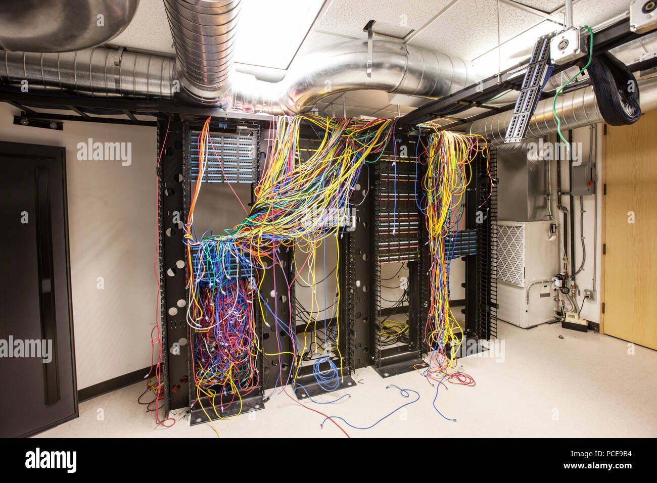 A mess of Cat 5 cables in an office server room Stock Photo - Alamy