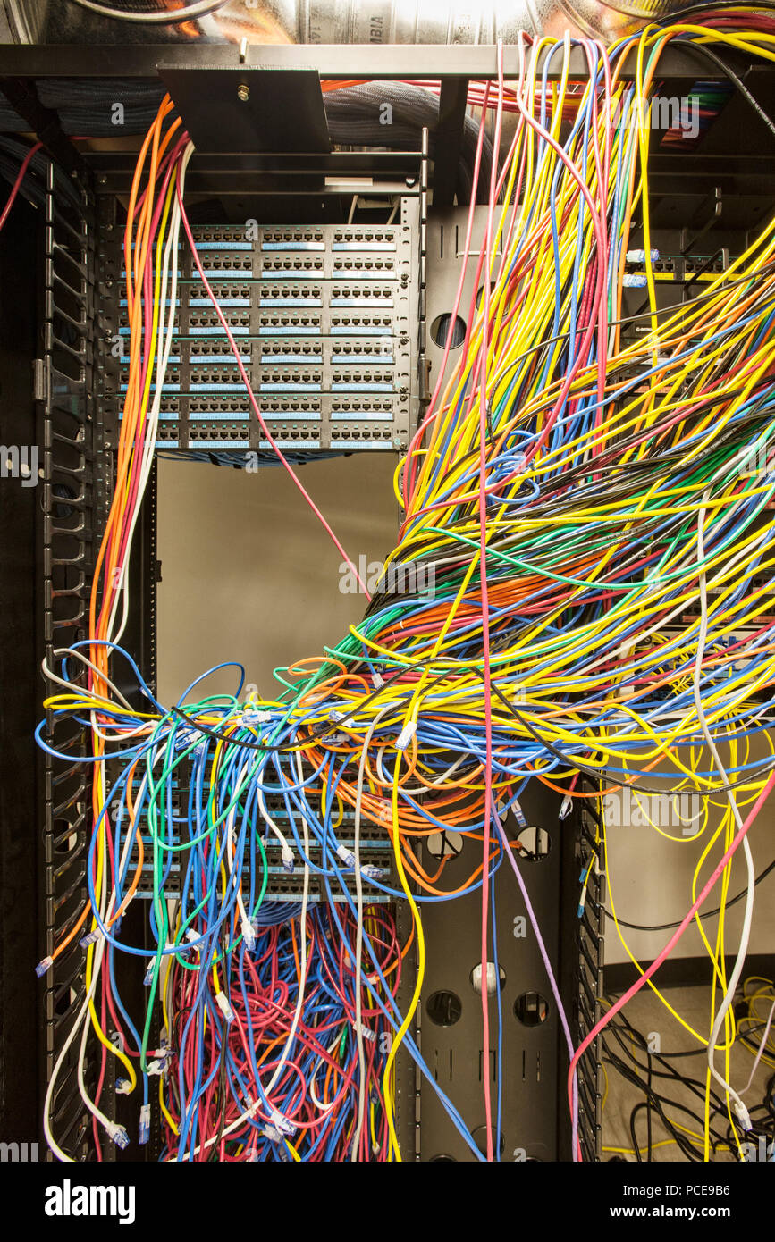 A mess of Cat 5 cables in an office server room Stock Photo - Alamy
