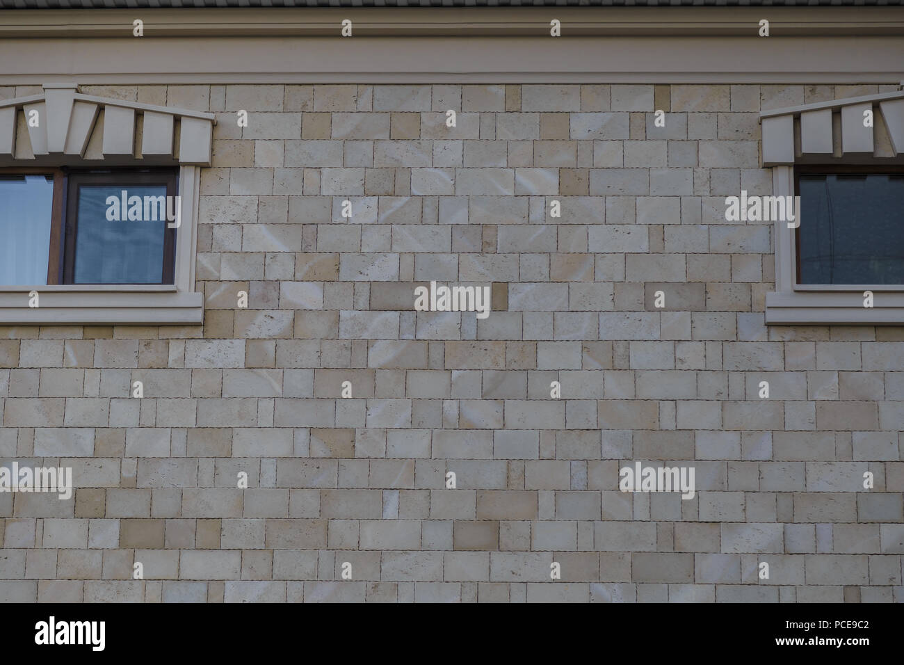 Wall of a house with windows in a classic design Stock Photo - Alamy