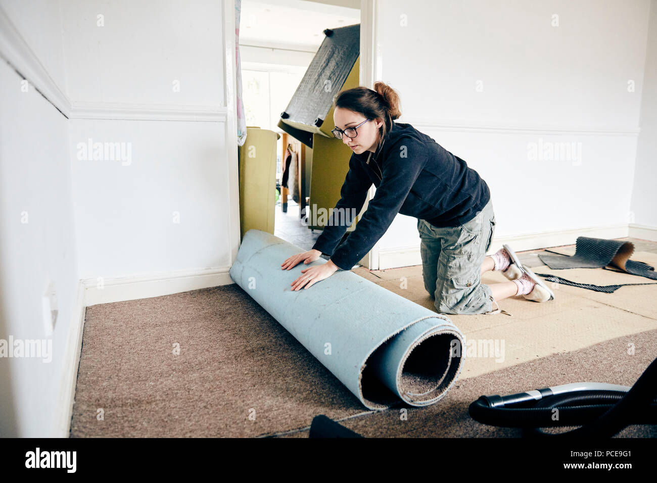 Woman rolled up in carpet hi-res stock photography and images - Alamy
