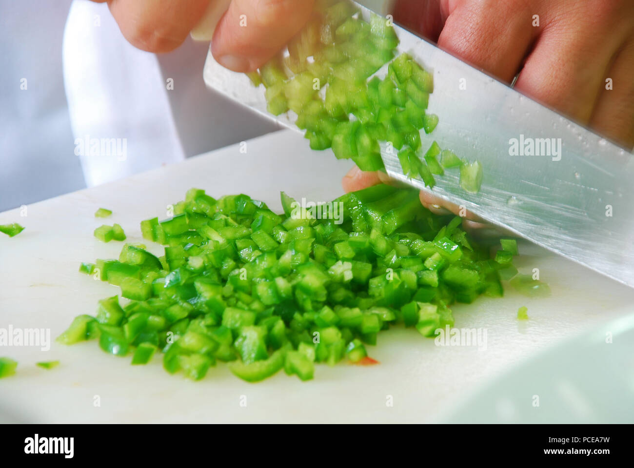 Hand slicing red green chili hi-res stock photography and images - Alamy