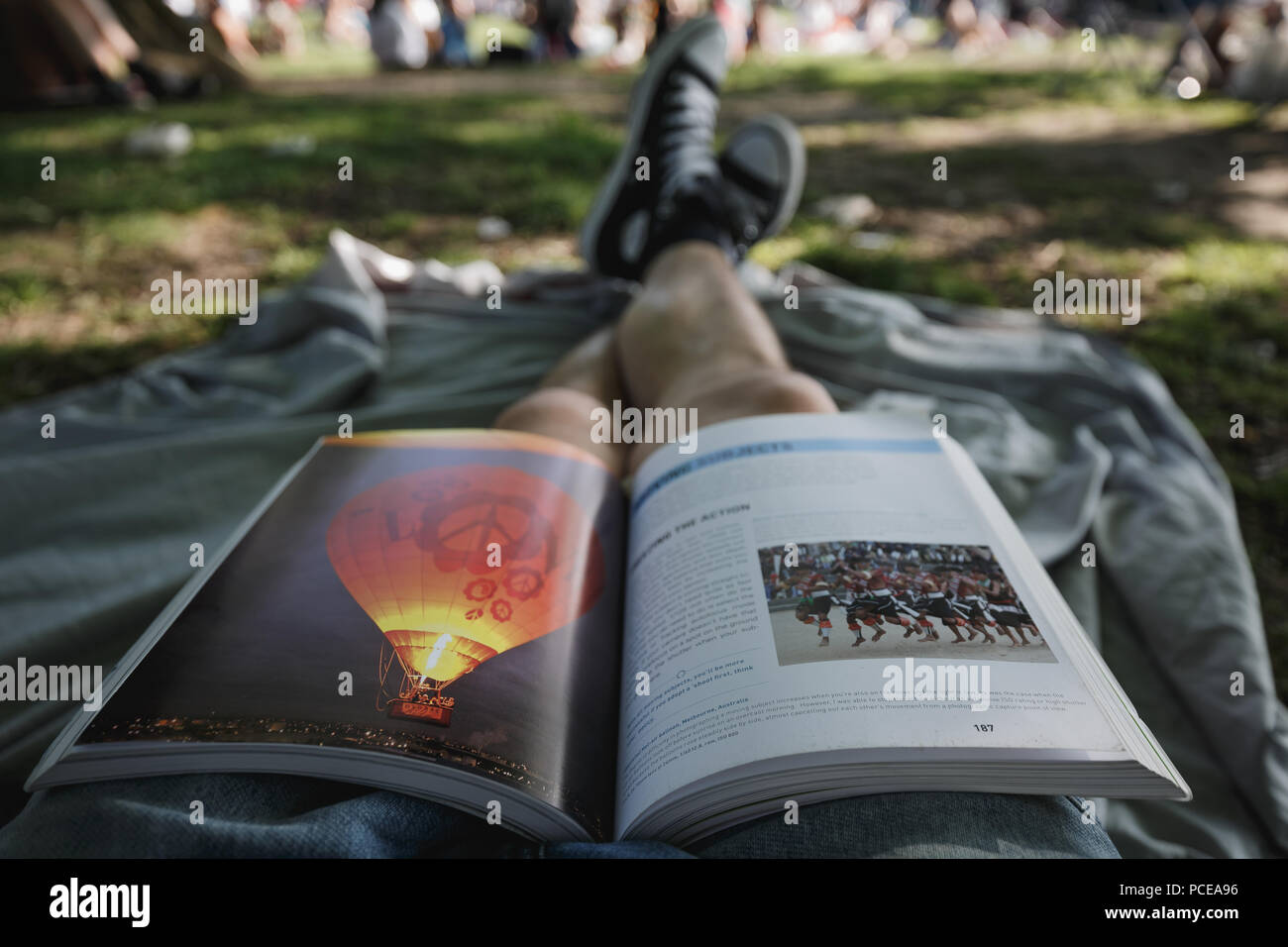 Man reading under a tree hi-res stock photography and images - Alamy