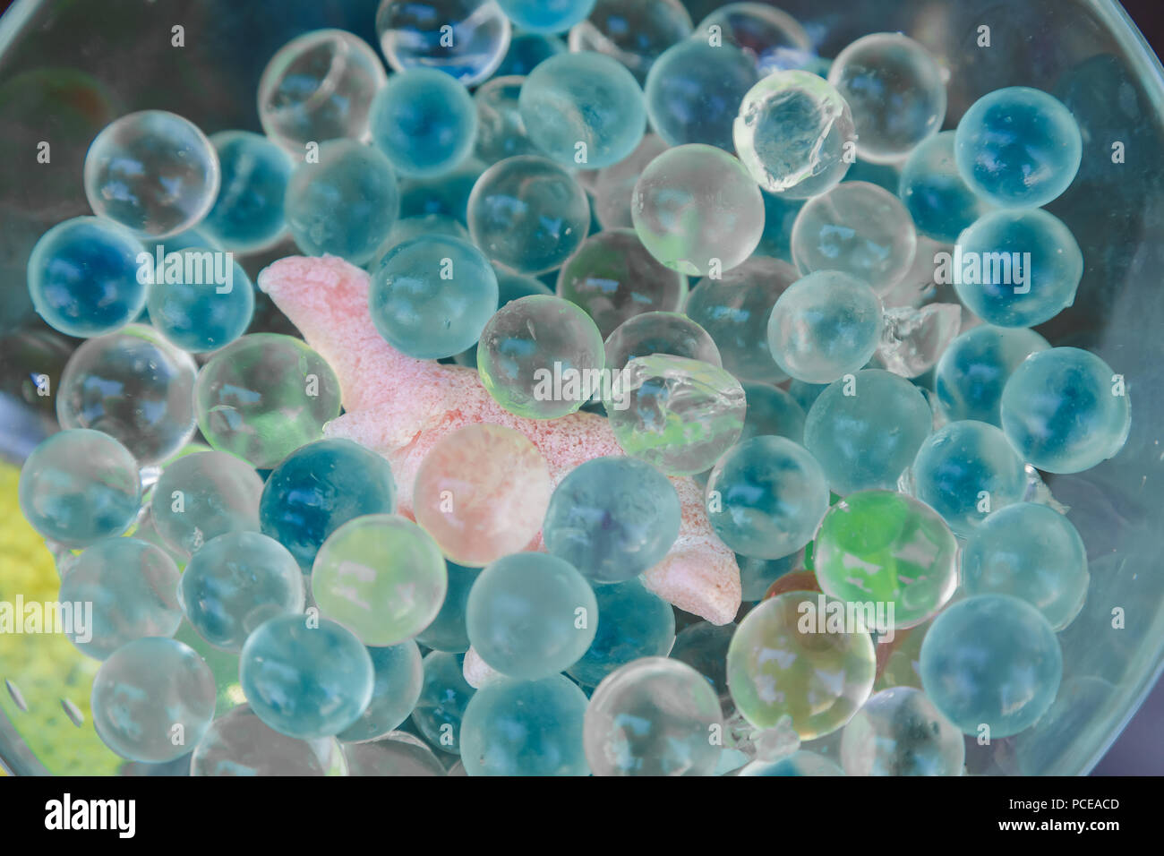 Glass balls in a storage vessel on a bright day Stock Photo - Alamy
