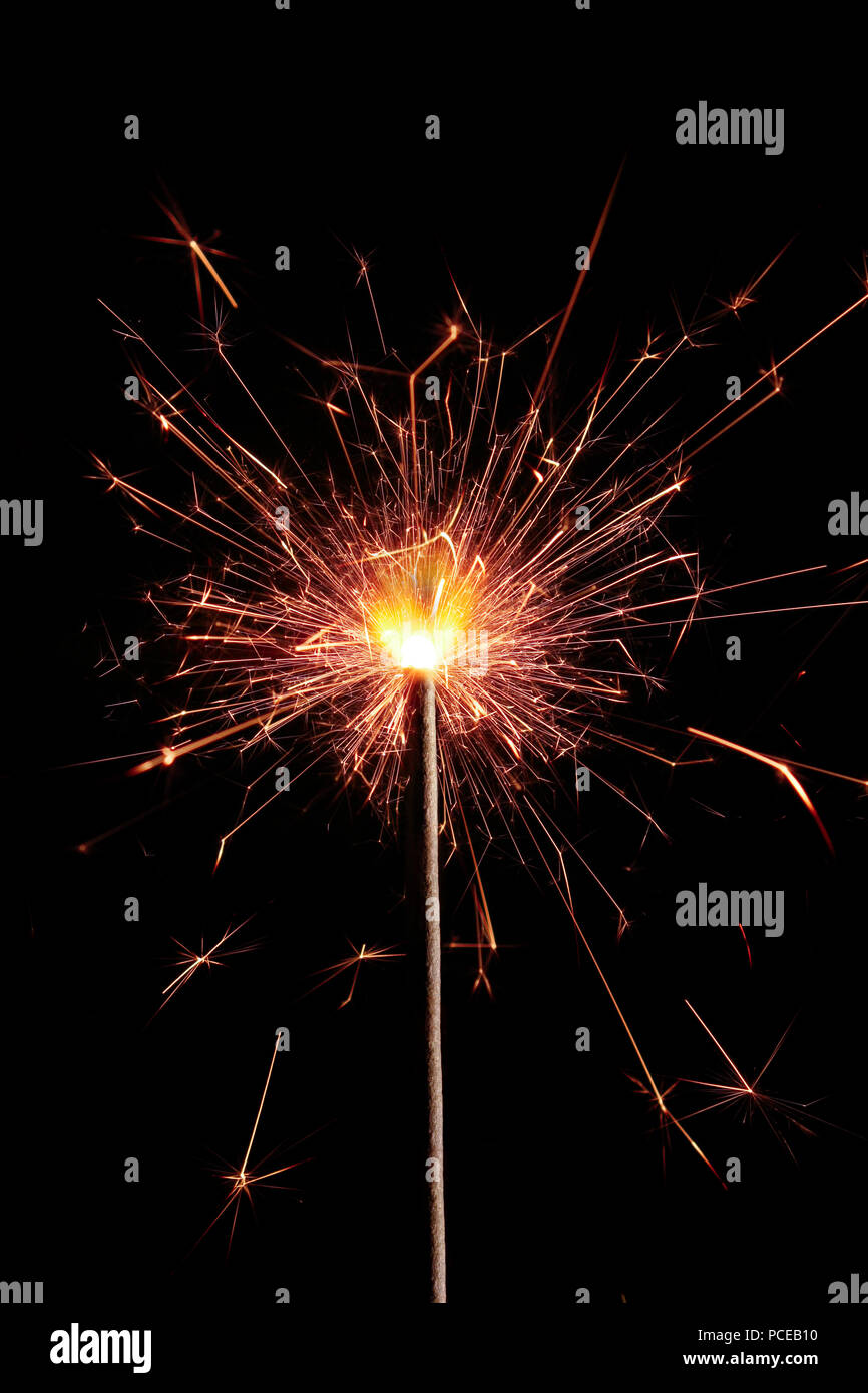 Celebration festive sparkler sparks in the dark Stock Photo - Alamy