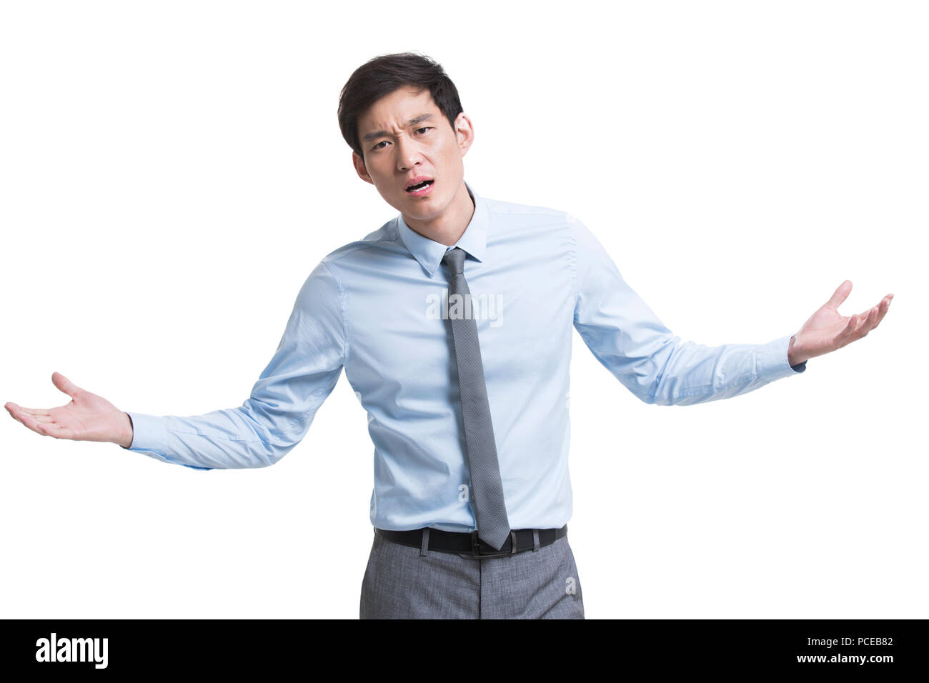 Angry Chinese businessman shrugging Stock Photo - Alamy