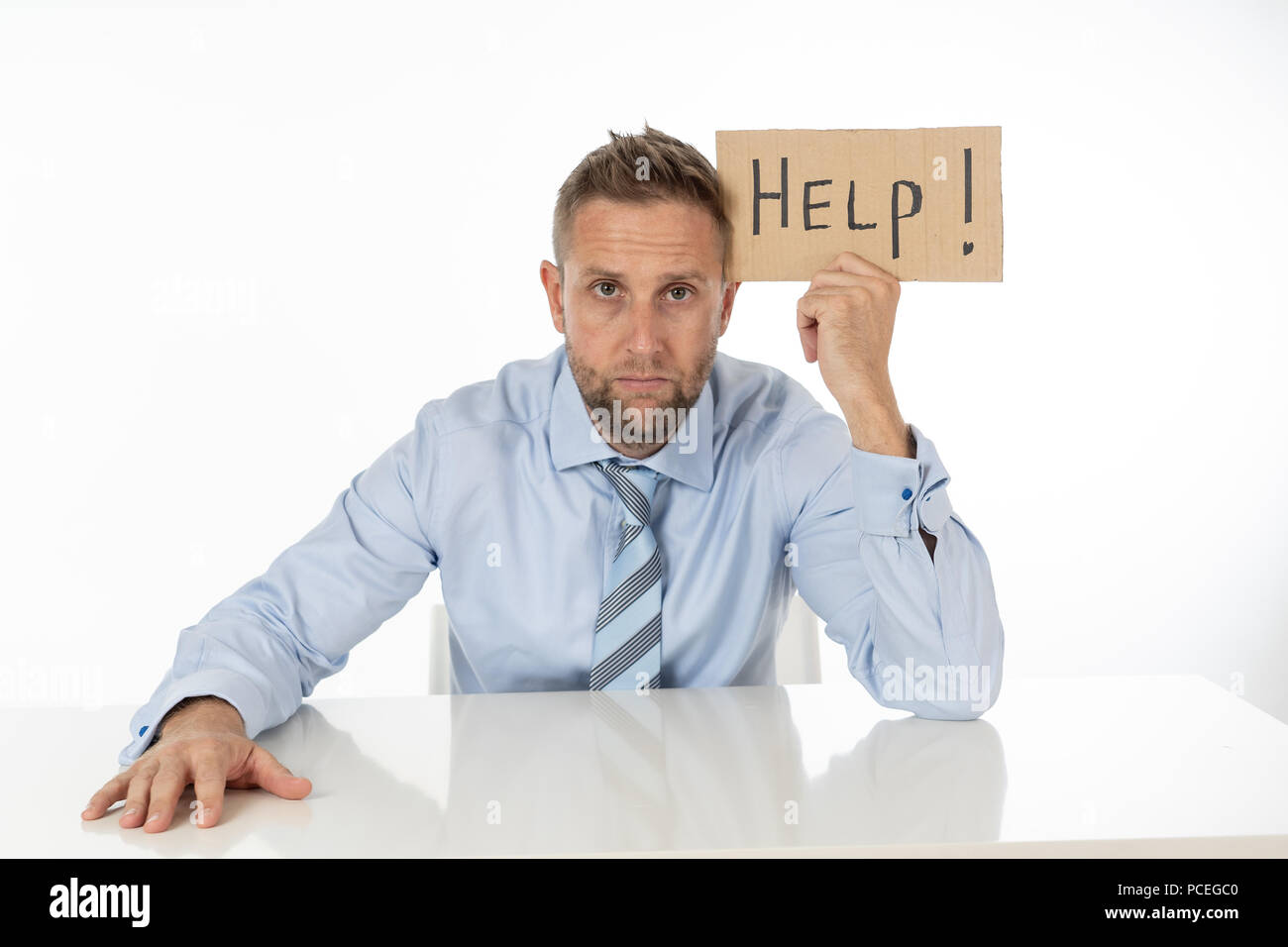 Businessman holding help sign message Stock Photo - Alamy