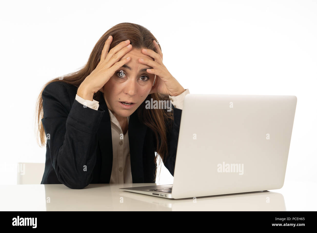 Business woman desperate with computer Stock Photo - Alamy