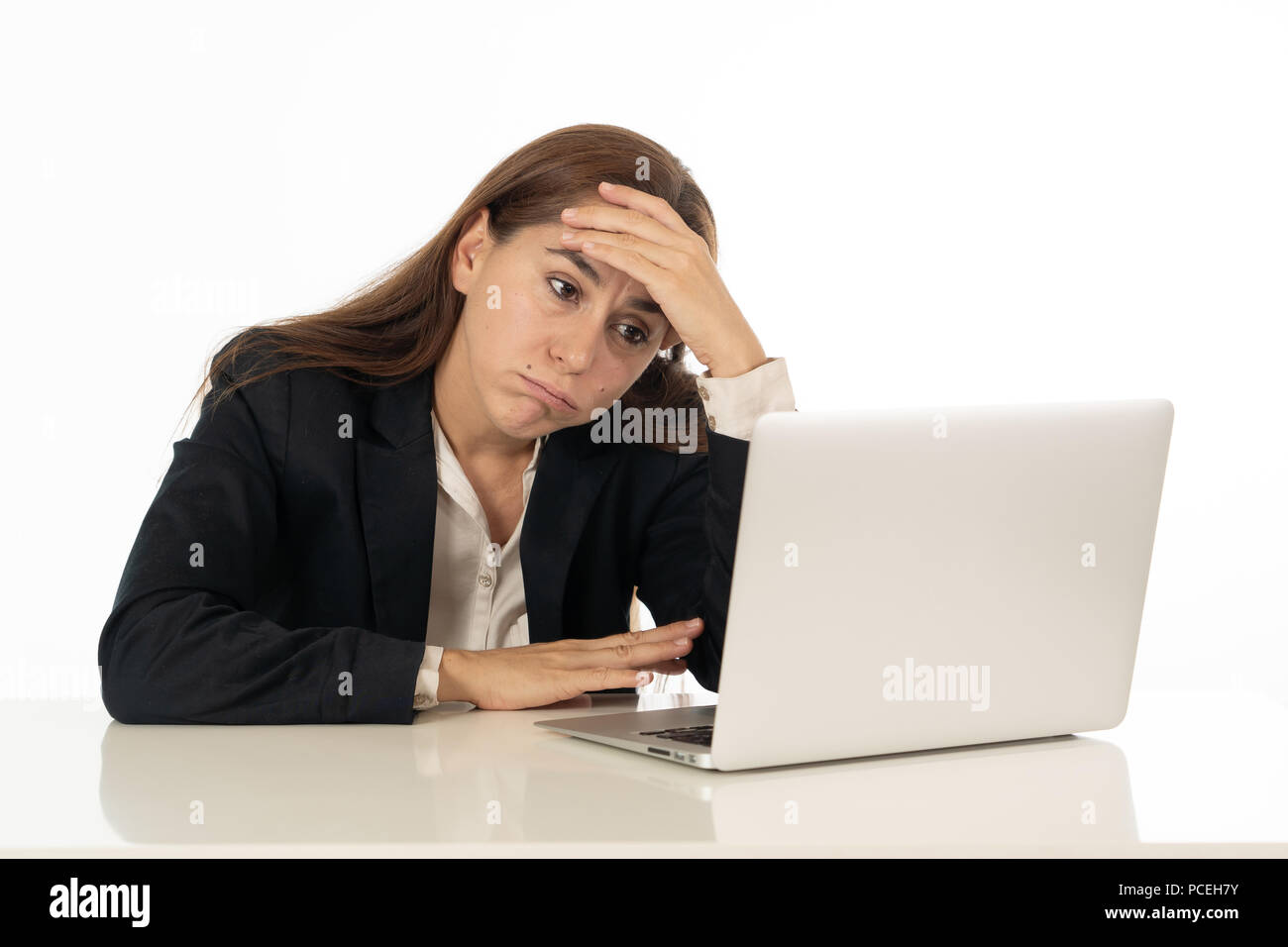 Business woman desperate with computer Stock Photo - Alamy