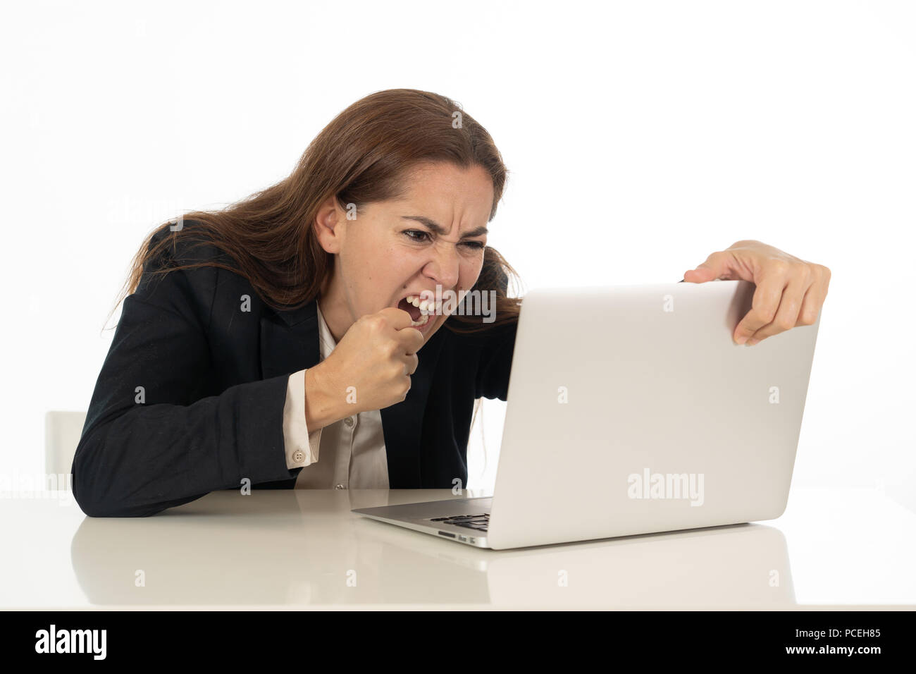 Business woman desperate with computer Stock Photo - Alamy