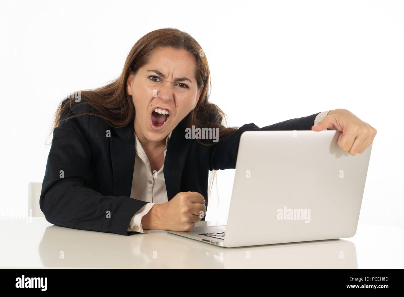 Business woman desperate with computer Stock Photo - Alamy
