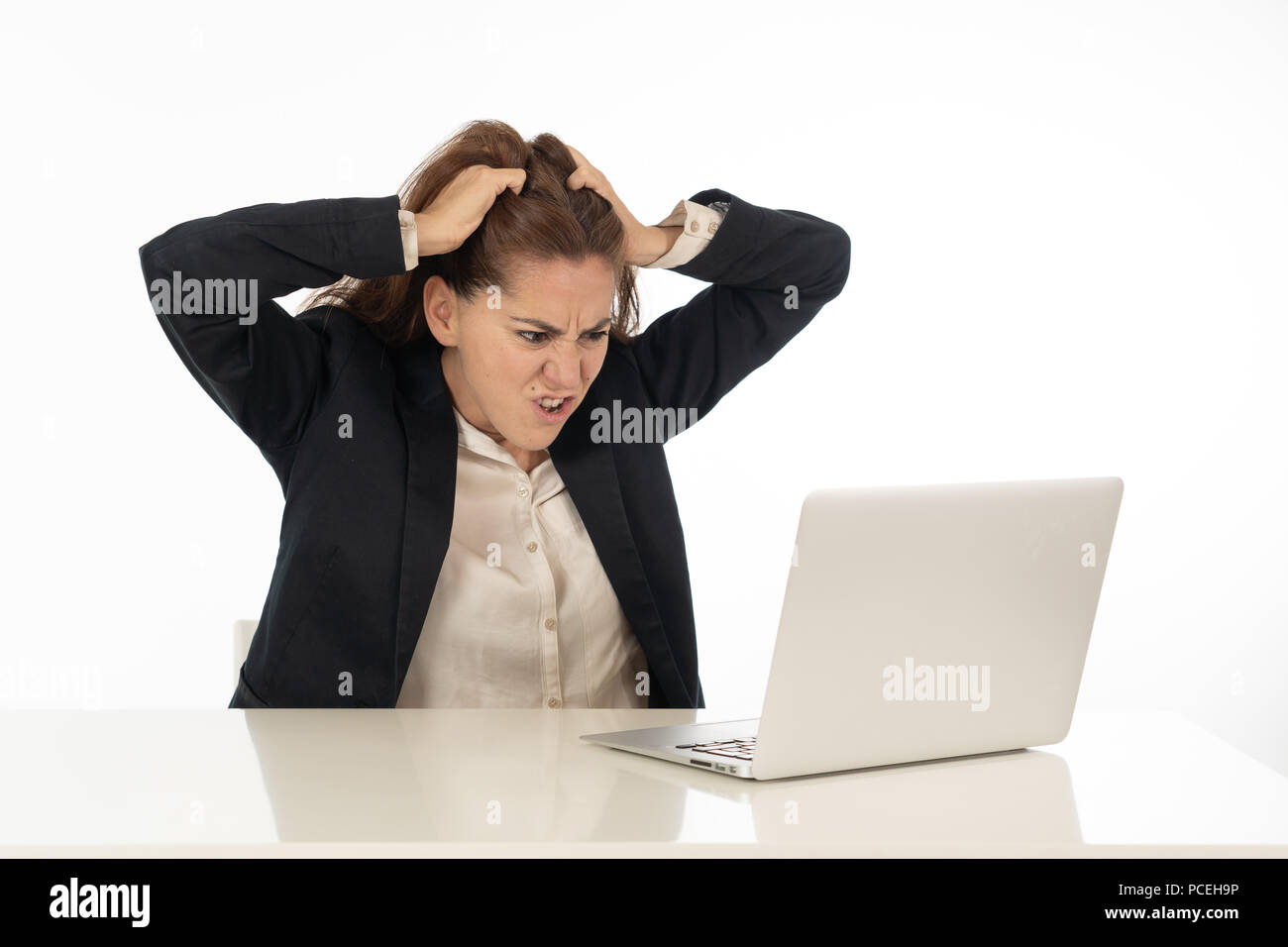 Business woman desperate with computer Stock Photo - Alamy