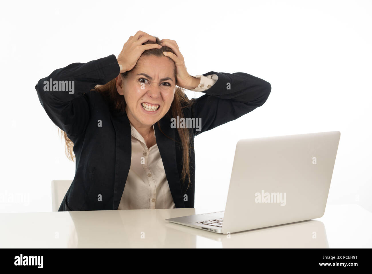 Business woman desperate with computer Stock Photo - Alamy