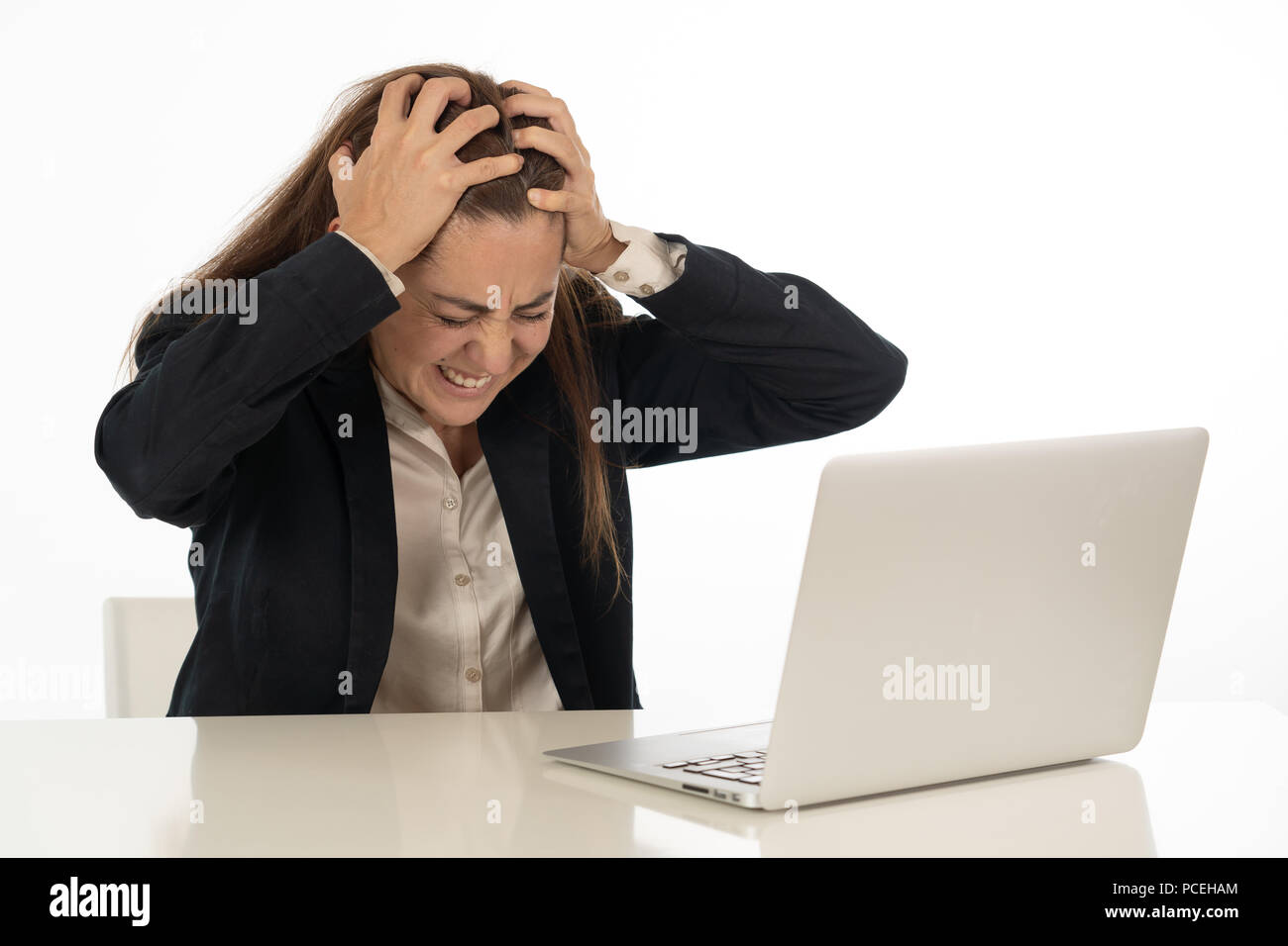 Business woman desperate with computer Stock Photo - Alamy