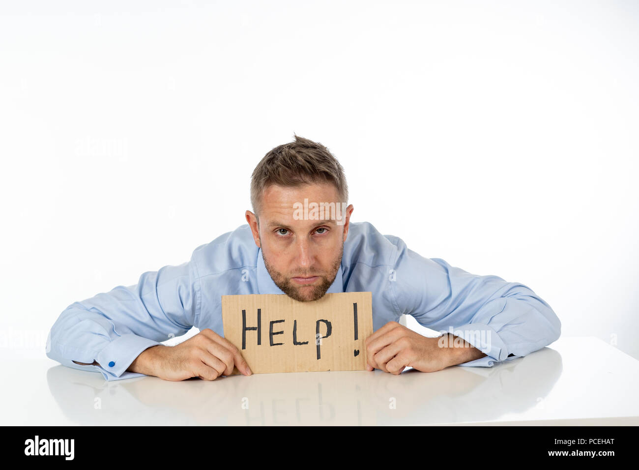Sad businessman holding cardboard sign hi-res stock photography and ...