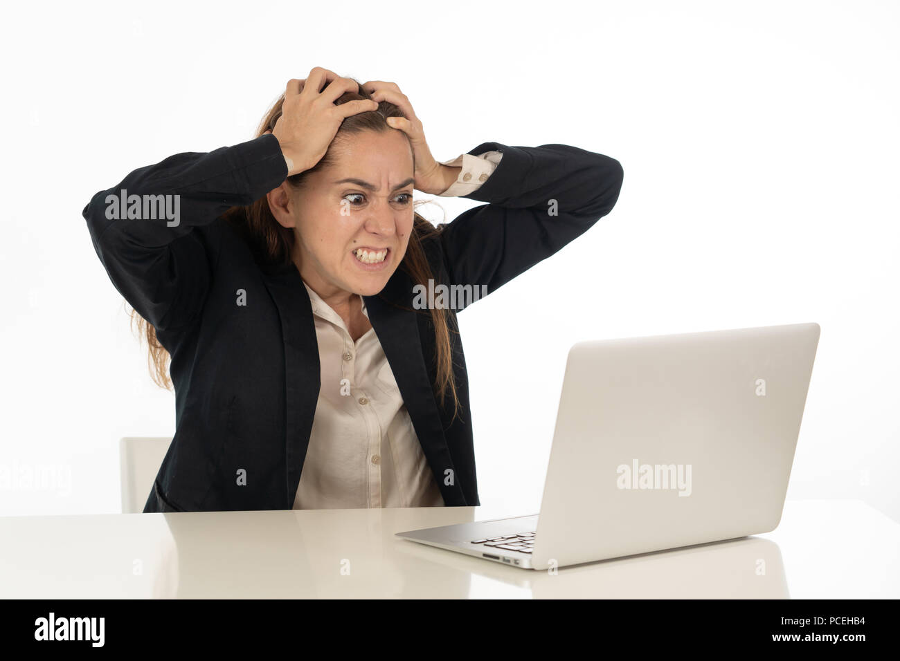 Business woman desperate with computer Stock Photo - Alamy