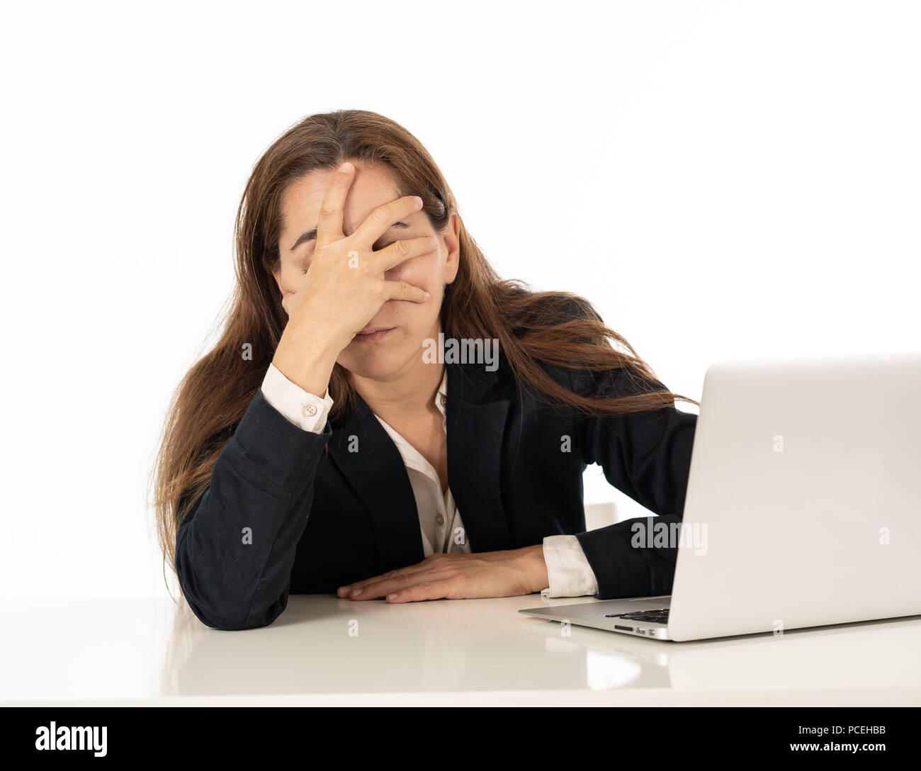 Business woman desperate with computer Stock Photo - Alamy