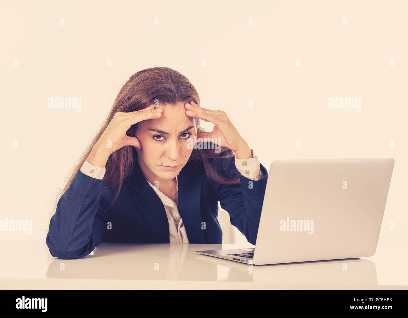Business woman desperate with computer Stock Photo - Alamy