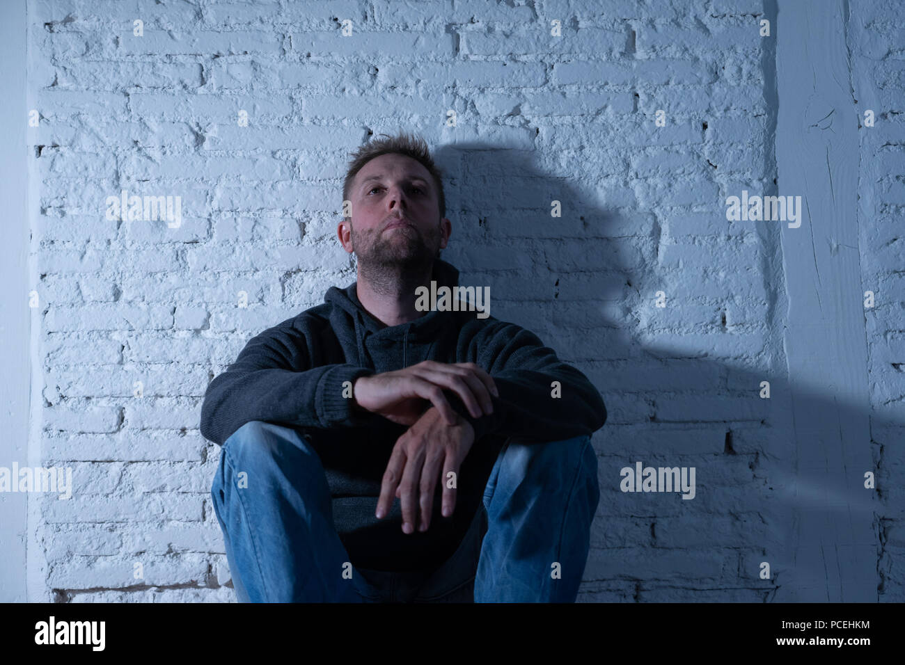 Lonely man suffering from depression Stock Photo - Alamy