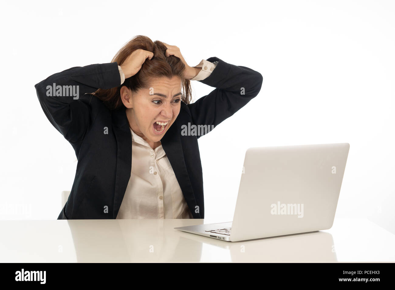 Business woman desperate with computer Stock Photo - Alamy