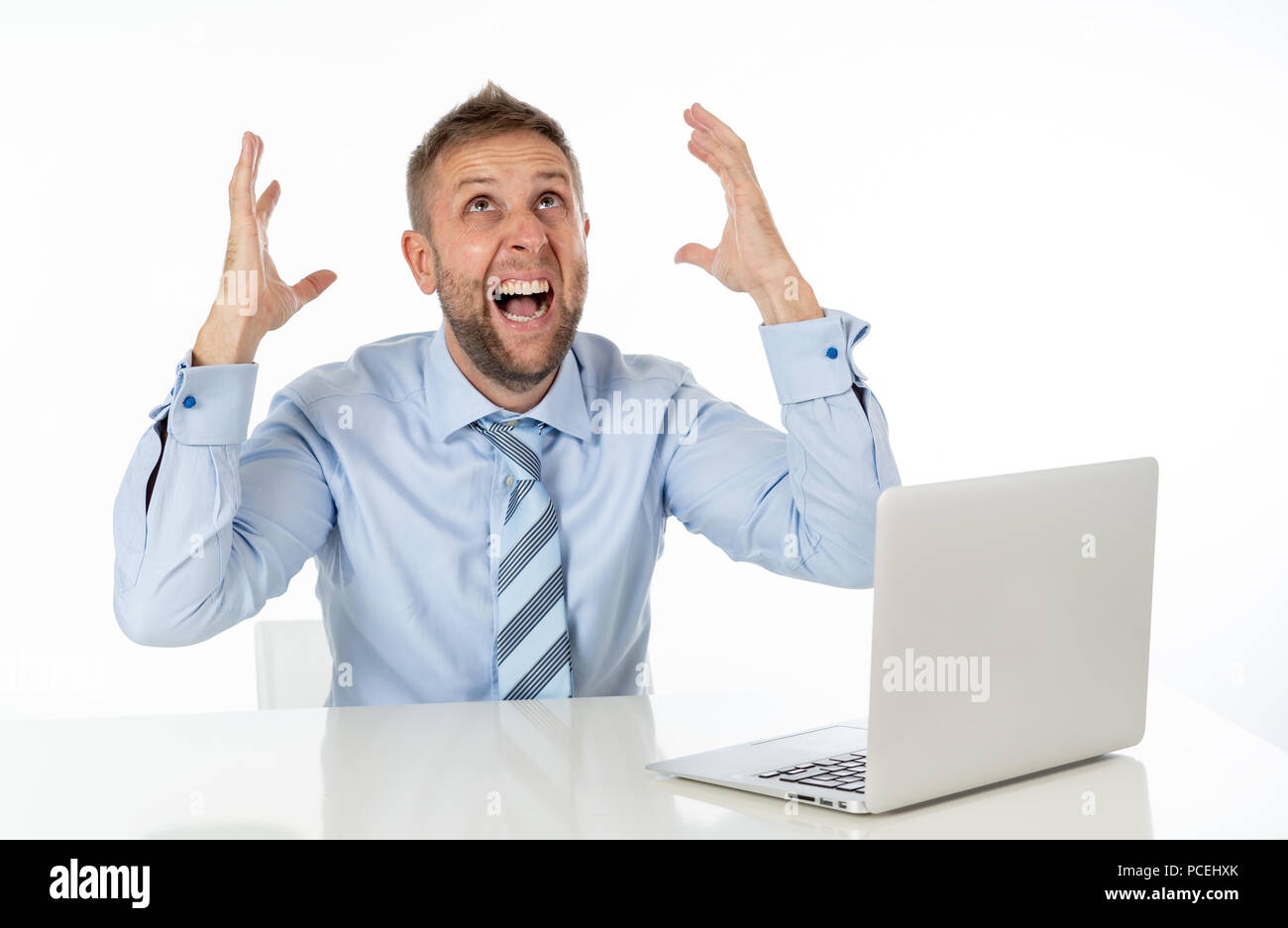 Businessman desperate with laptop Stock Photo - Alamy