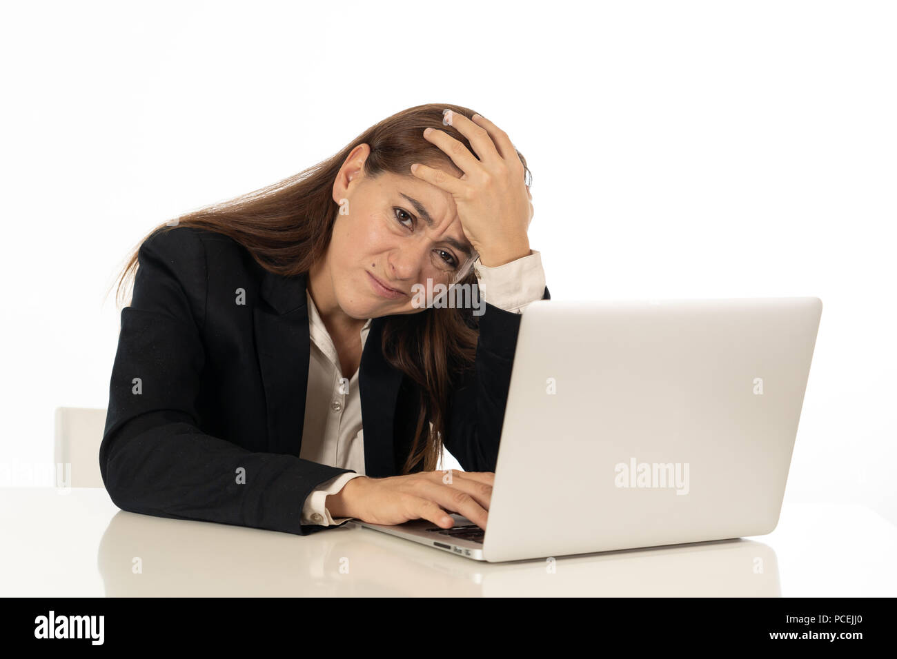 Business woman desperate with computer Stock Photo - Alamy