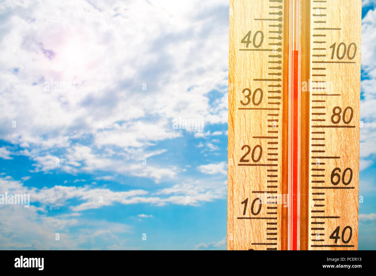 Thermometer displaying high 40 degree hot temperatures in sun summer ...