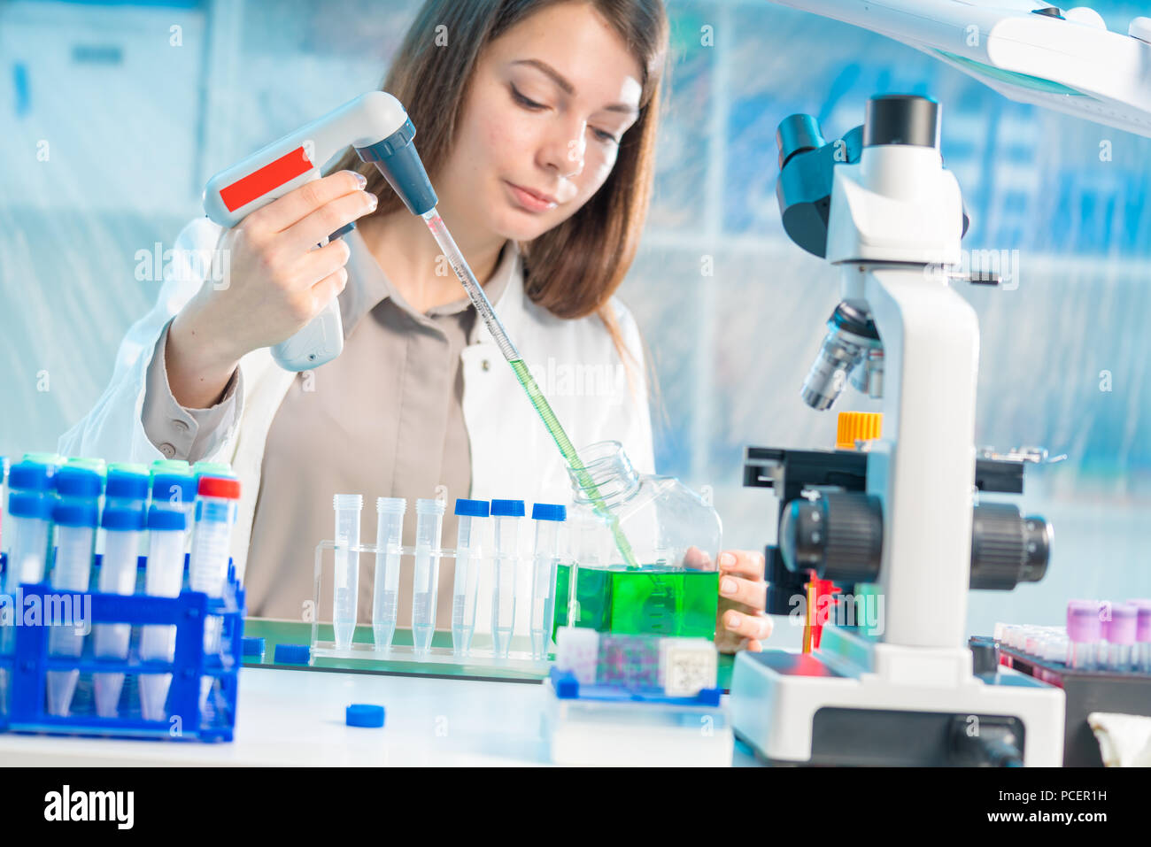 Chemical laboratory scientist woman working with pipette Stock Photo ...