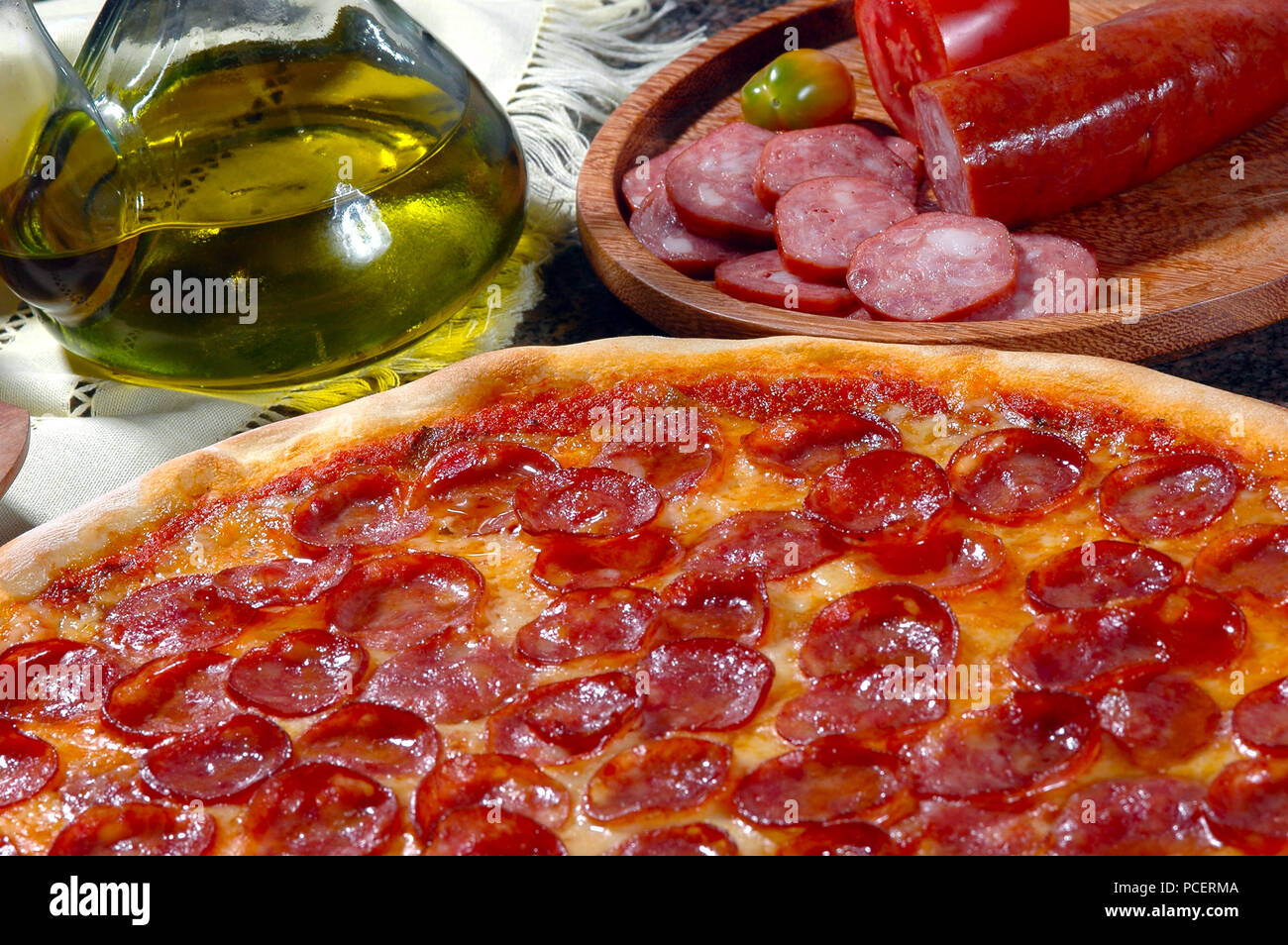 Pizza pepperoni with olive oil Stock Photo - Alamy