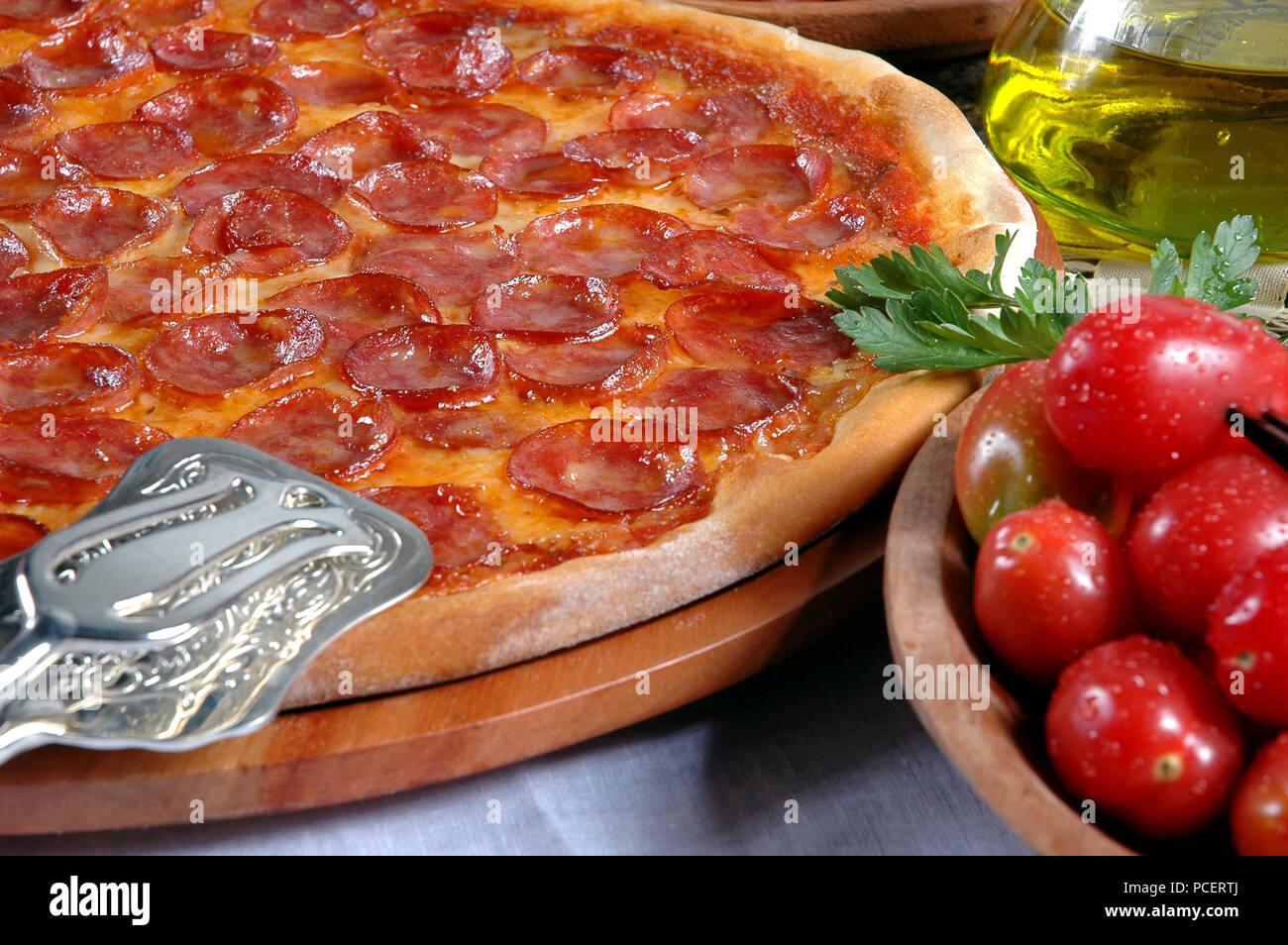Pizza pepperoni with olive oil Stock Photo - Alamy