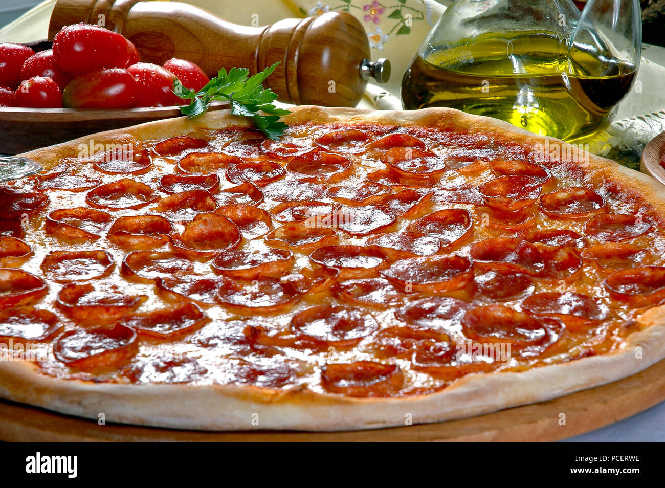 Pizza pepperoni with olive oil Stock Photo - Alamy