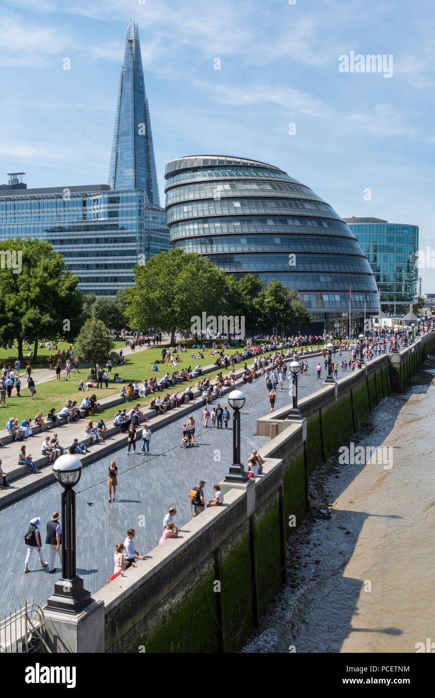 crowds on the banks of the river thames at more london riverside or ...