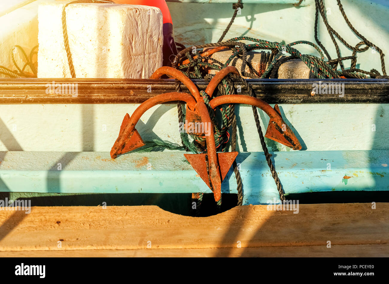 Rusty anchor inside a small boat Stock Photo - Alamy